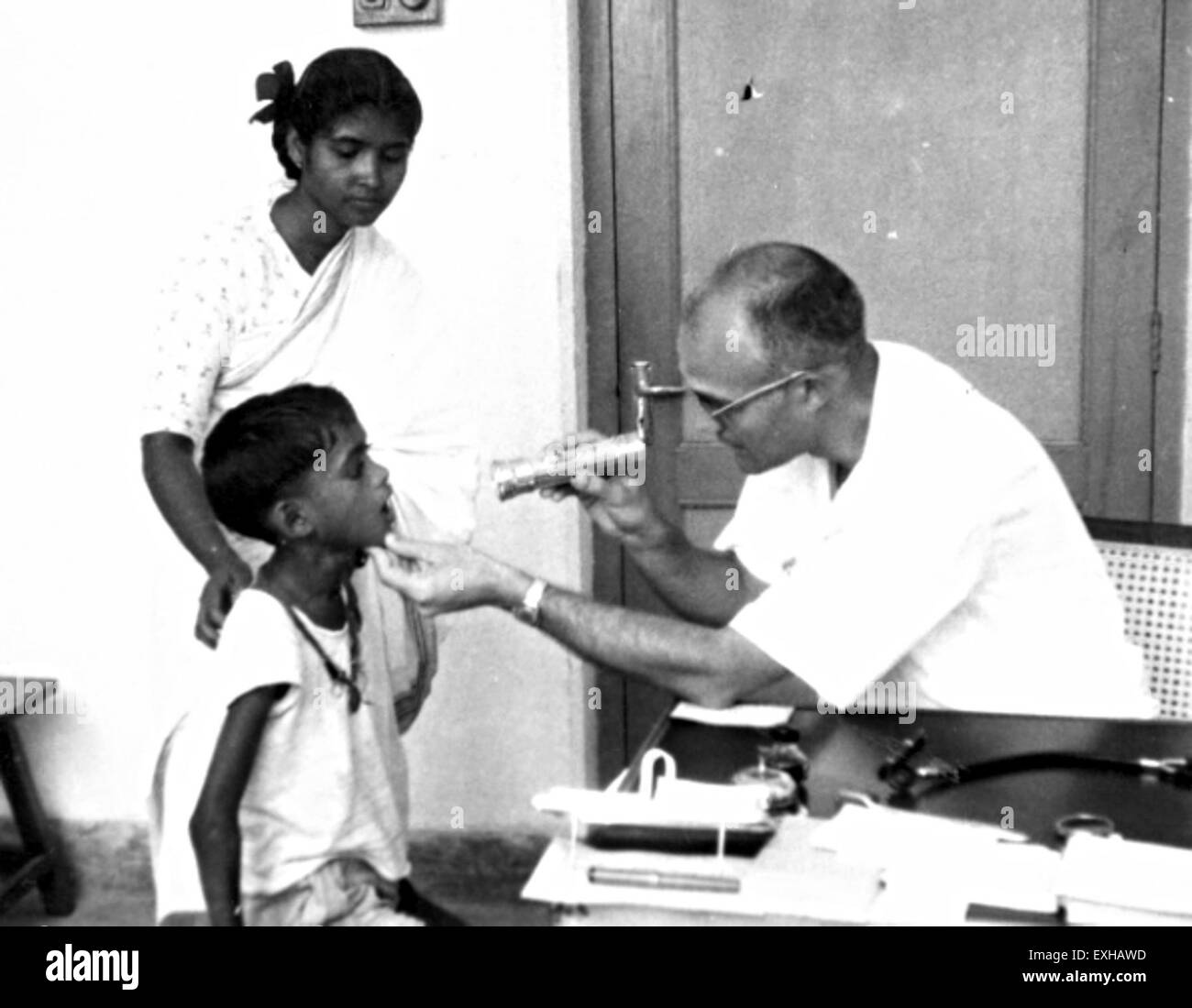 Dr. Kniss is seen providing medical care to a patient at Satbarwa ...