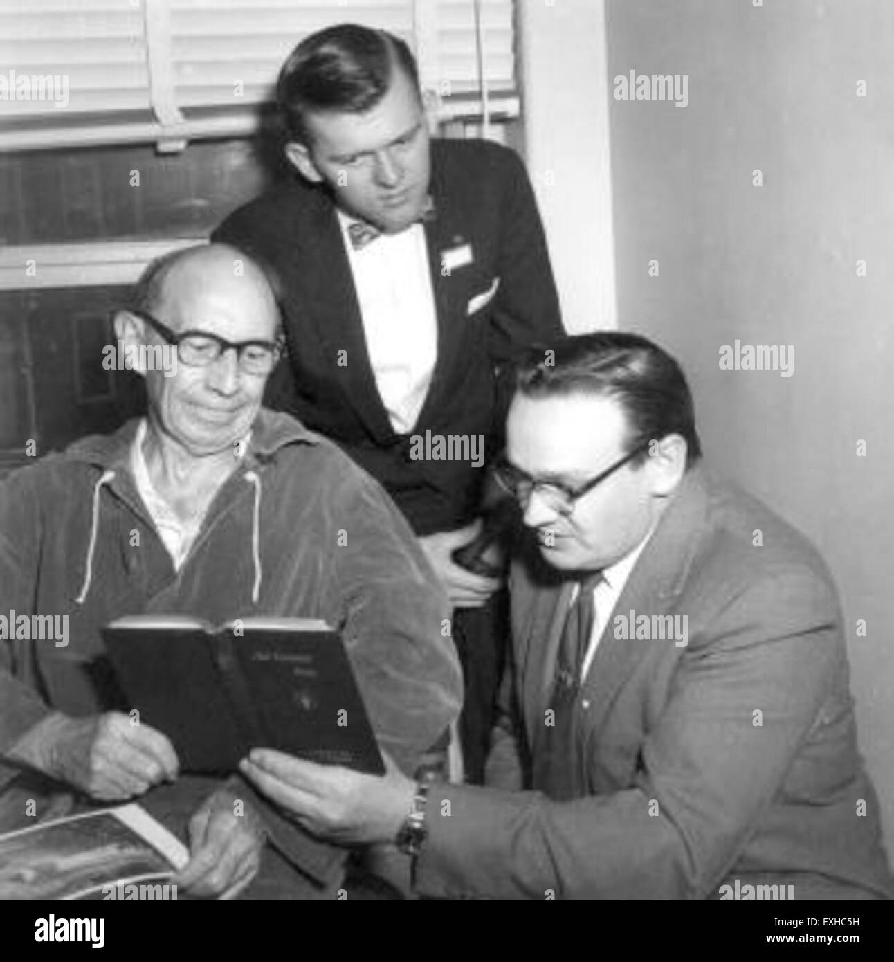 Al Penner, a chaplain in Denver, is shown with Gideon Bibles. This ...