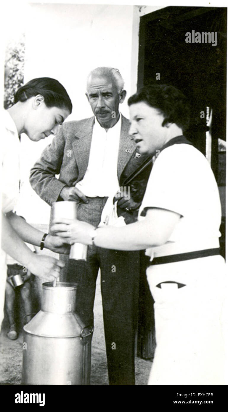 Giving Out Milk Stock Photo - Alamy