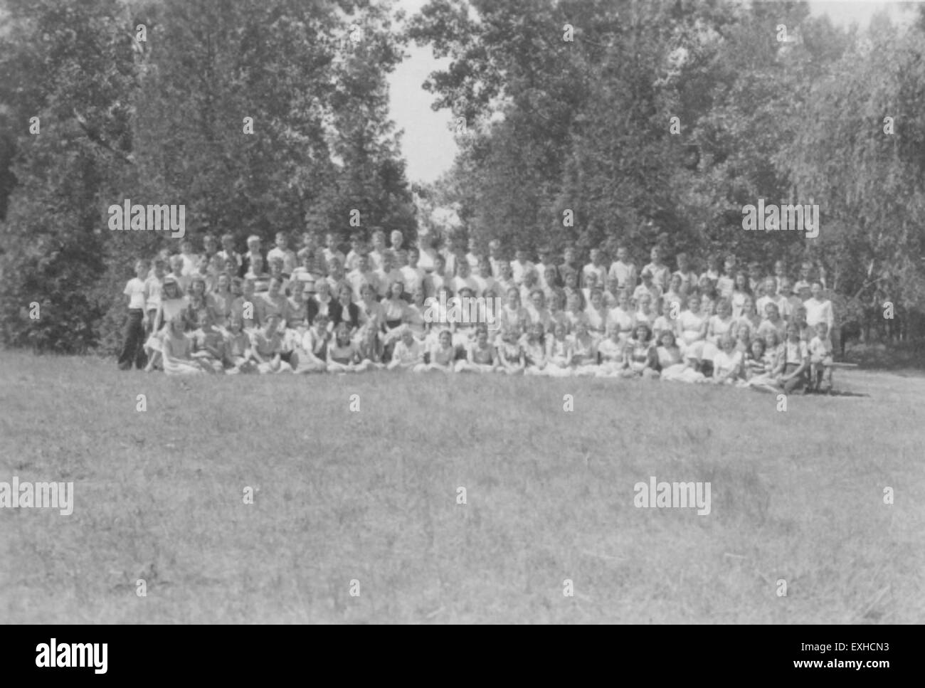 This image shows a group gathered at Little Eden Camp, likely ...