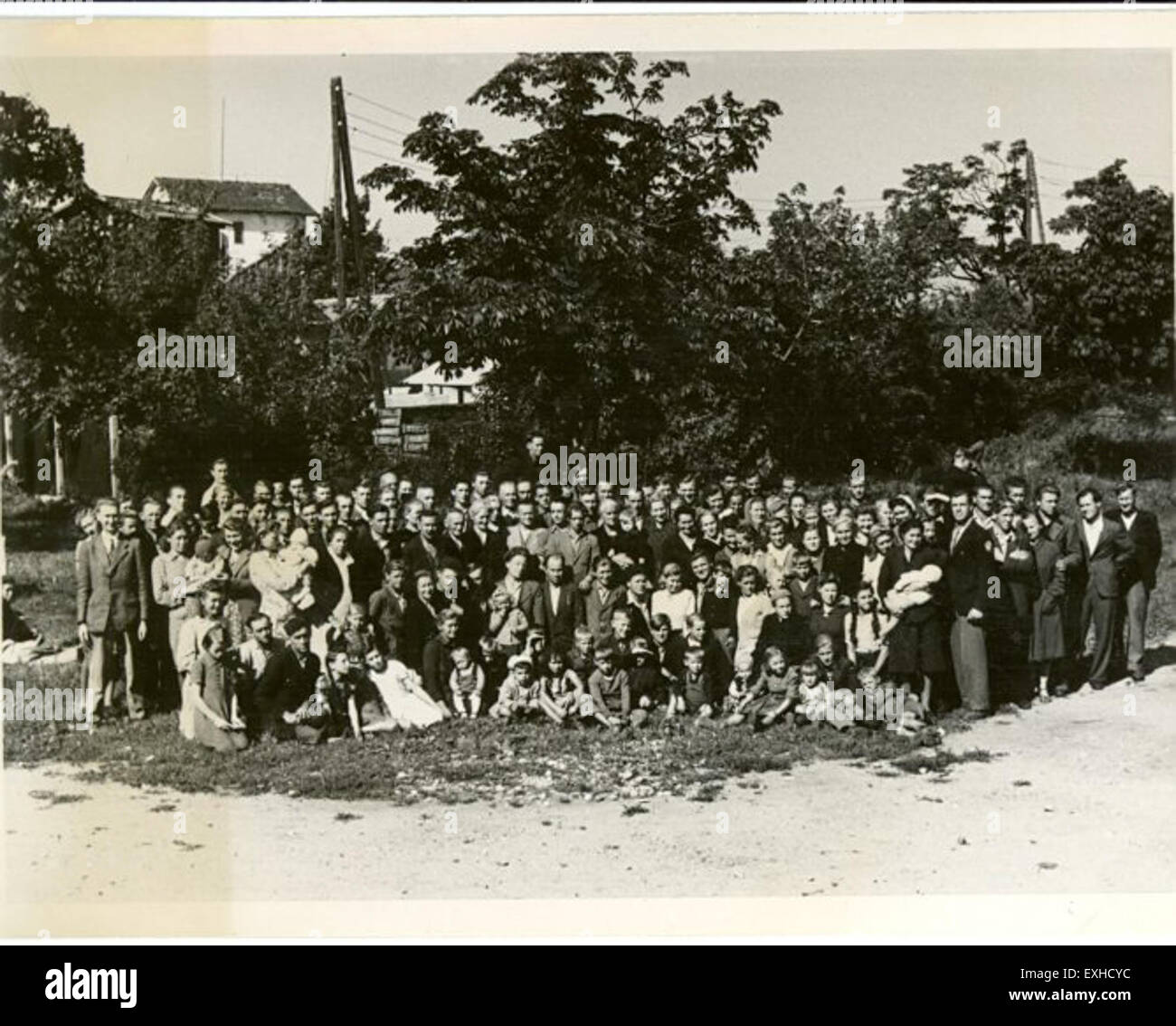 A group of Mennonite refugees at Linz Bahnhof in Germany, assisted by ...