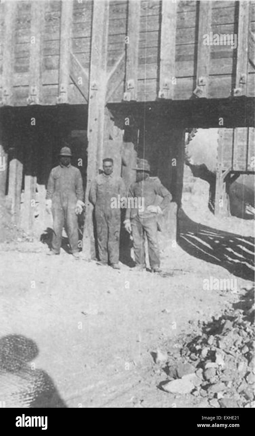 Workers labor in a quarry, extracting stone for construction ...