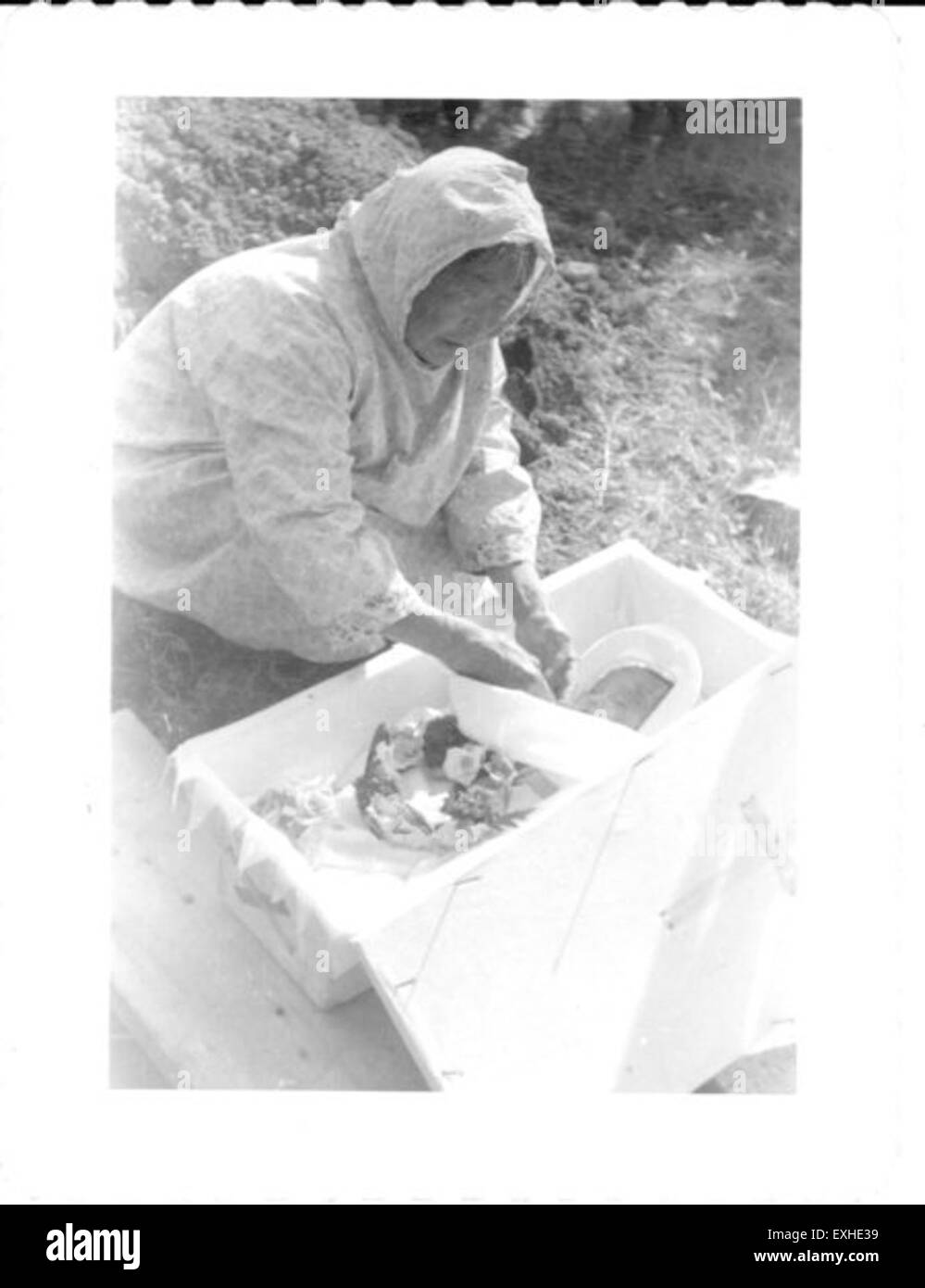 This photograph shows an infant in a coffin in Alaska, associated with ...