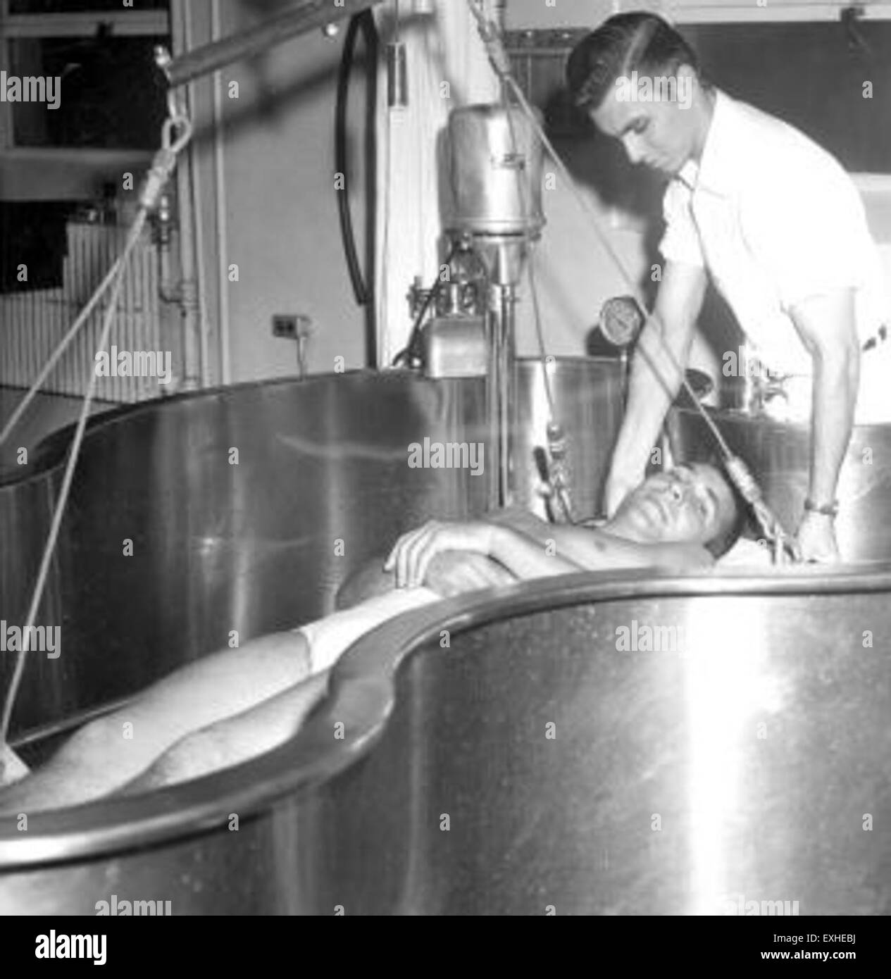 James Duncan assisting a patient with hydrotherapy, showcasing his work ...