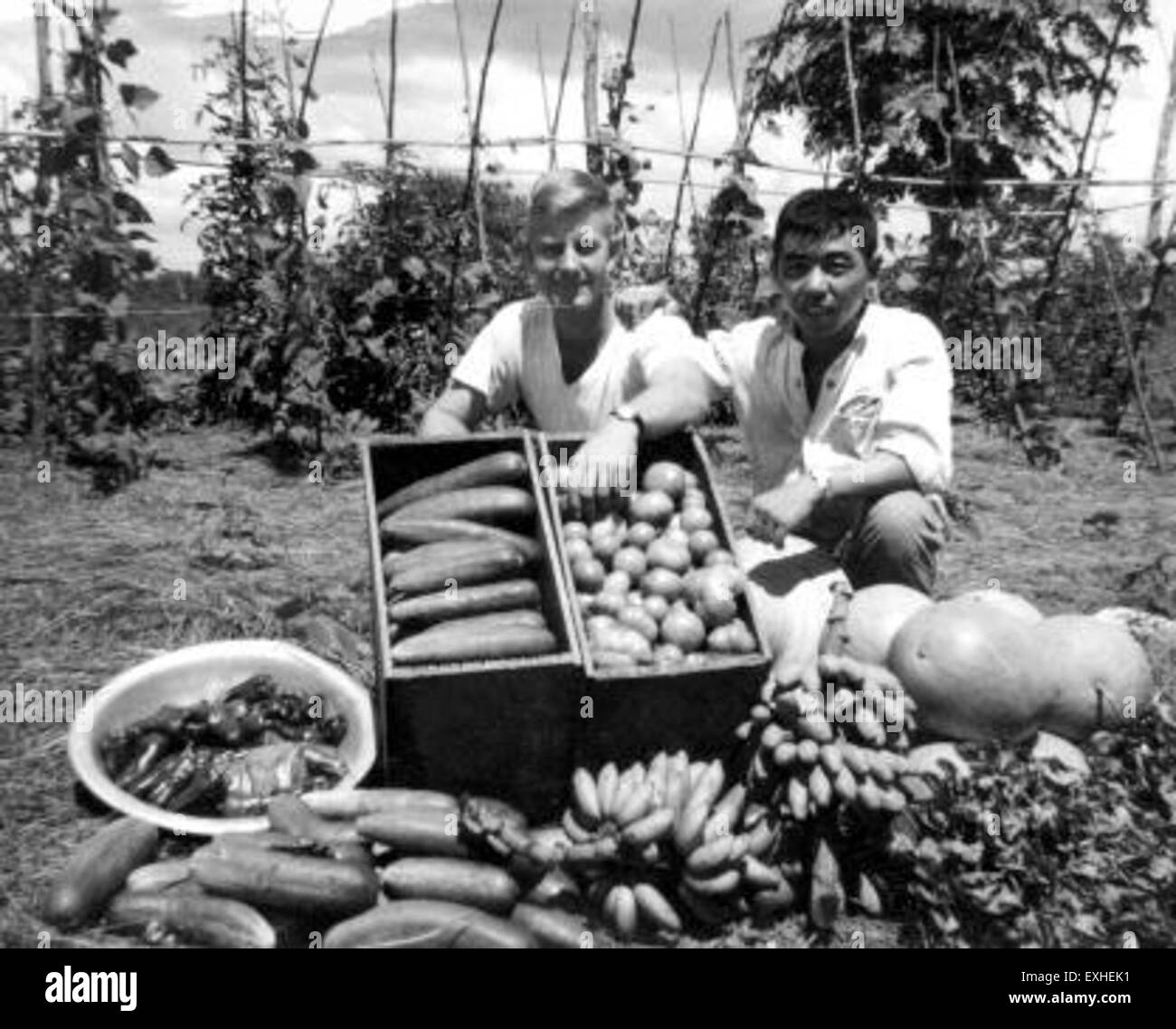 John Blough is pictured with a gardener, potentially engaged in ...