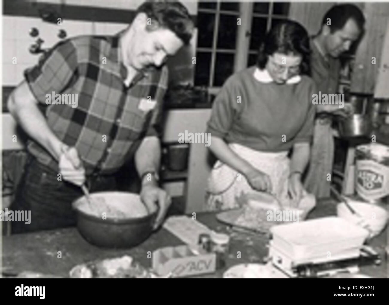 Anne Comtesse and Gerry Reimer prepare cookies as part of their work ...
