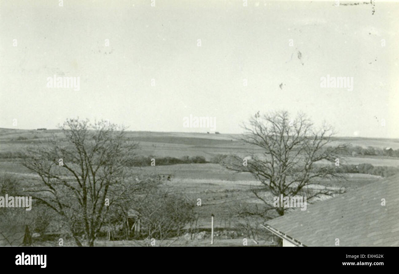 This image captures a rural farm setting in Malcolm, Nebraska, showing ...