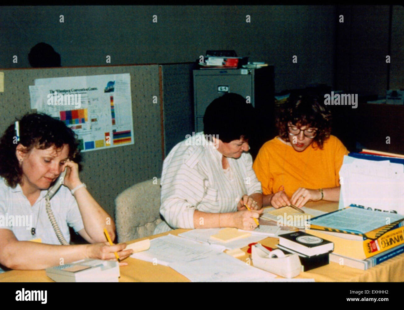This photograph documents Arlene Loewen and Janice Dyck-Epp working in ...