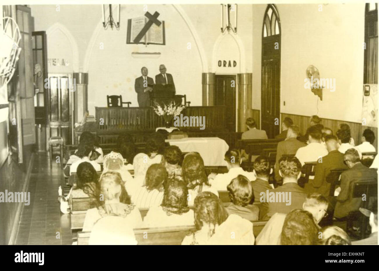This photograph captures Nelson Litwiller speaking at a convention in ...
