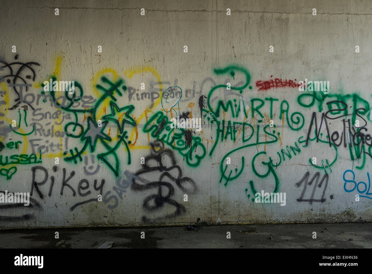 Graffiti on the exterior walls of a fish freezing plant, Grundarfjordur ...