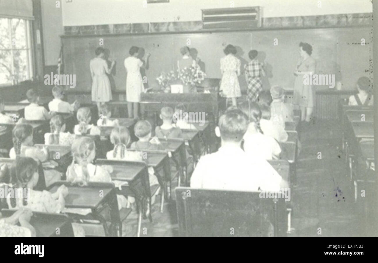 This photograph captures a historic moment at the Public School in Blue ...