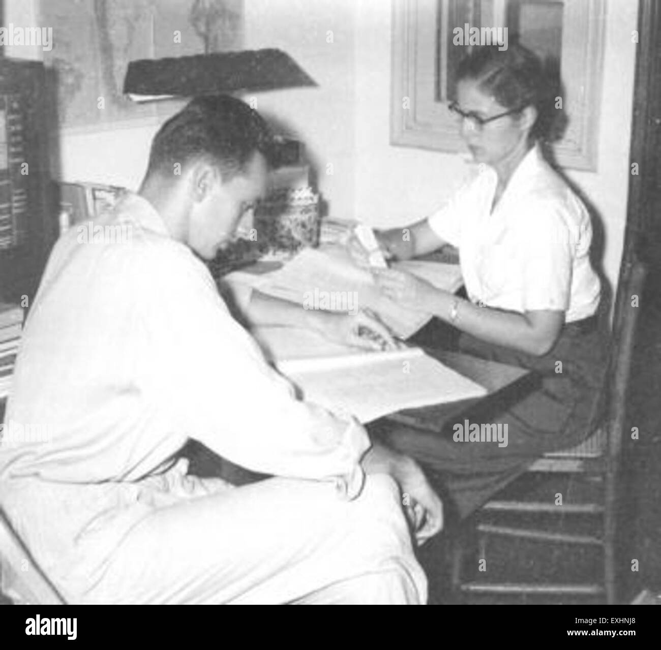 A vintage photograph showing Richard and Susan Burkholder engaged in a ...