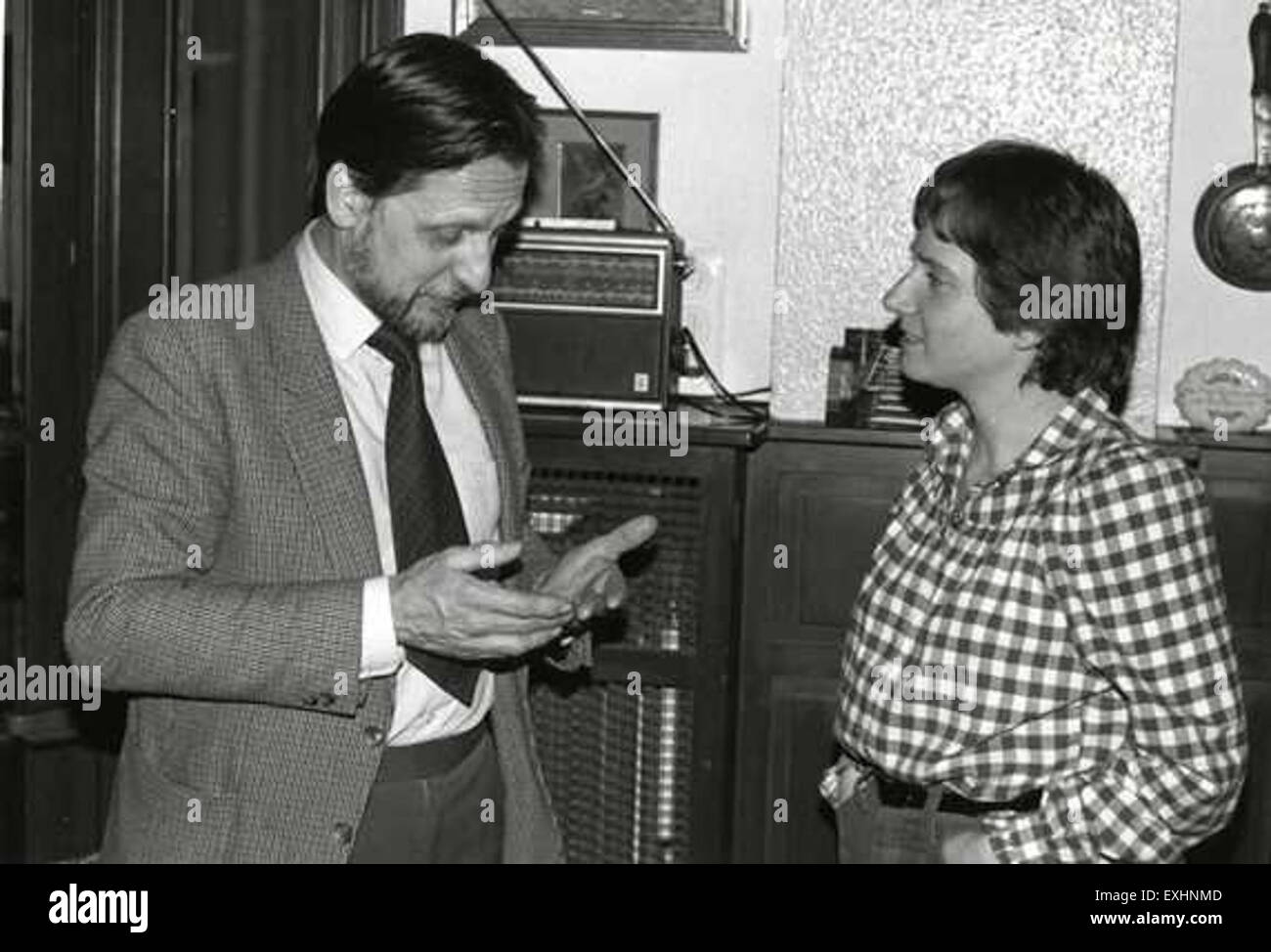 This image captures a moment of conversation between Robert Otto and a ...