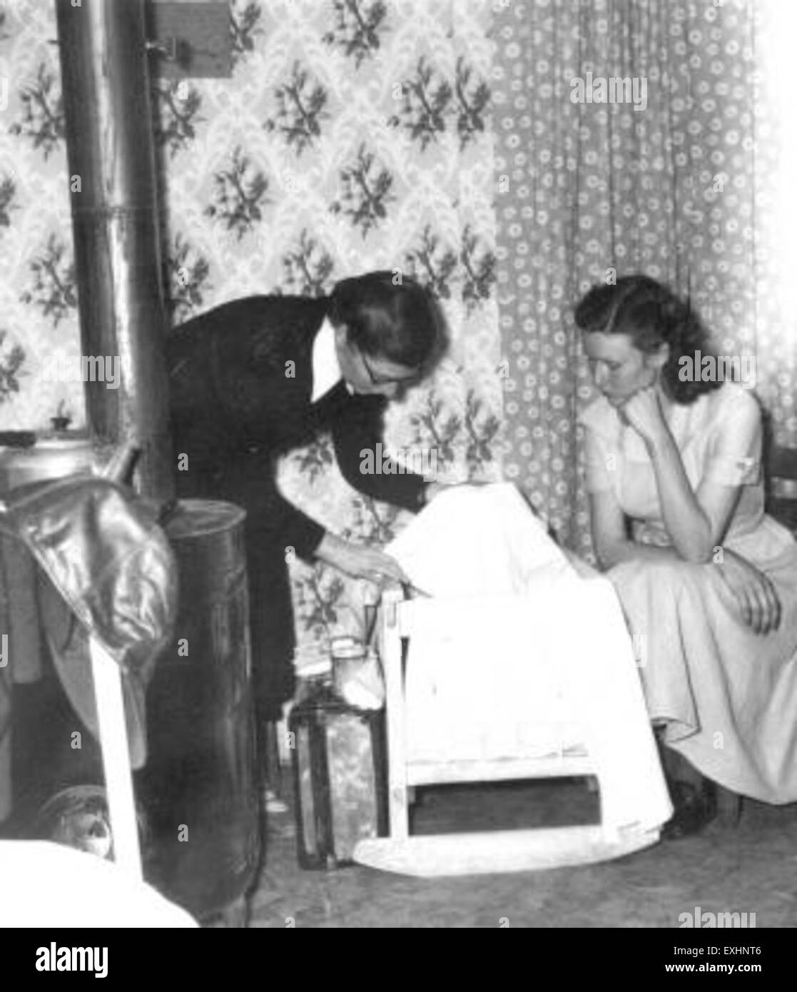 A historical photograph of Ruth Cressman holding her sick baby in Culp ...