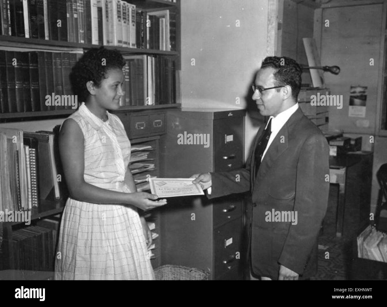 This image from 1957 depicts Samuel Rol, accompanied by a student ...