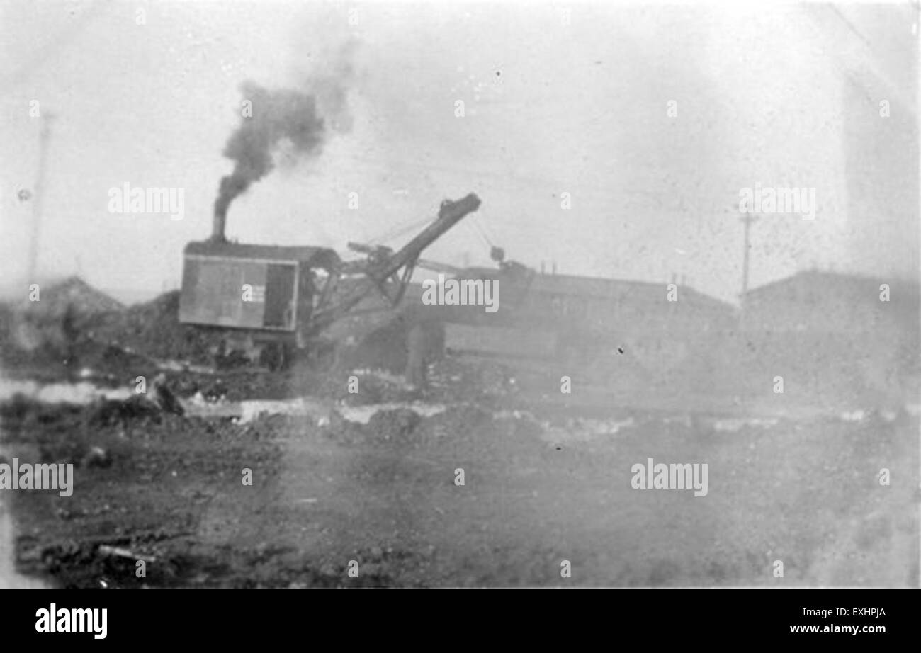 This photograph shows the operation of a steam-powered coal shovel, a ...