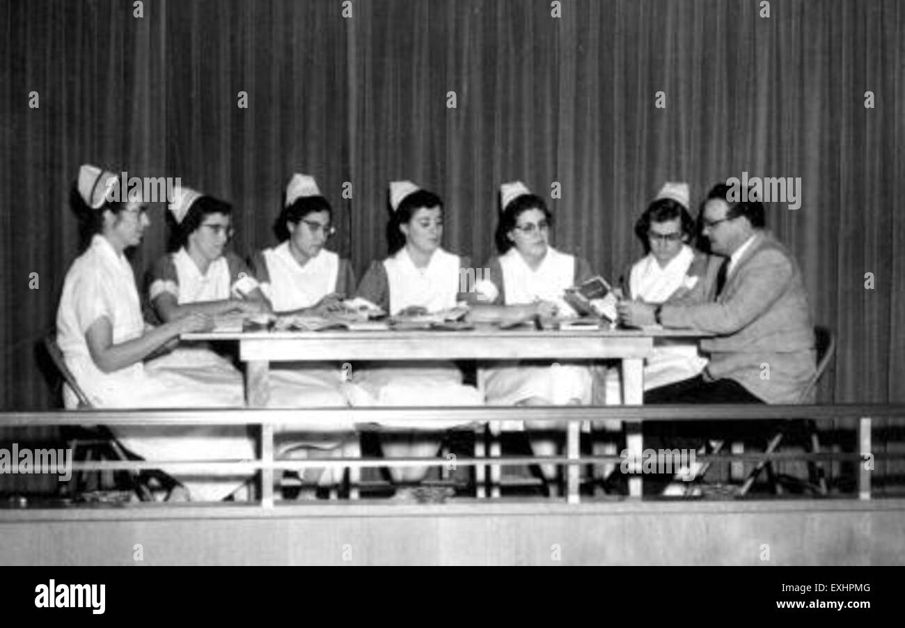 This image depicts student nurses and Chaplain Martin engaged in a ...