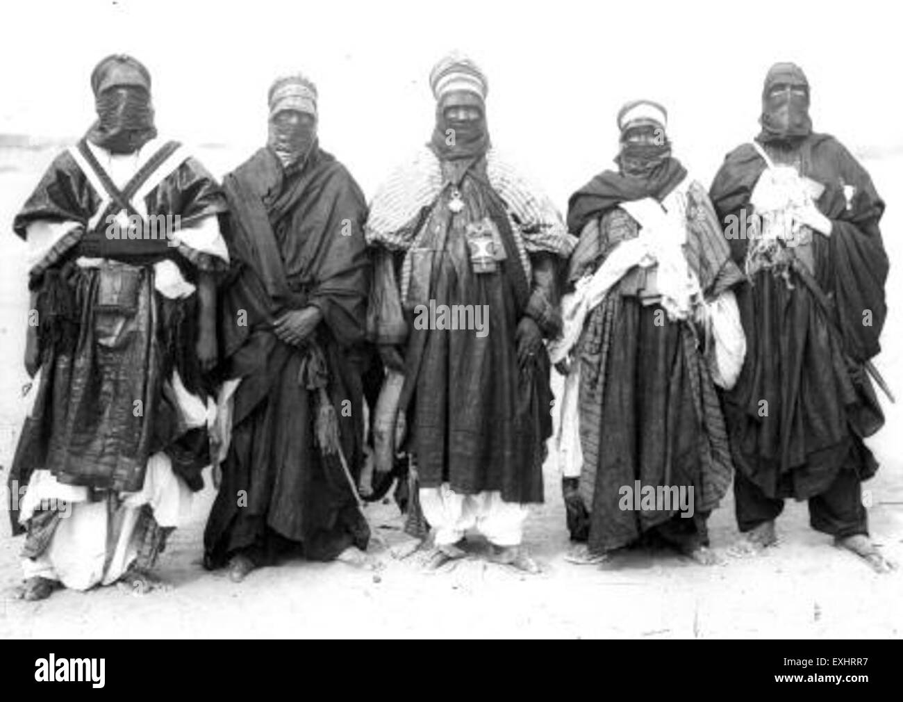 This photograph captures Tuareg men dressed in traditional clothing for ...