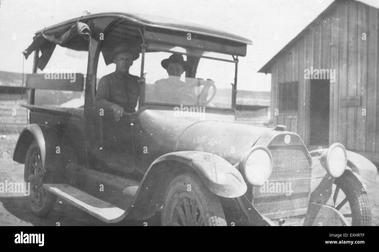This image of two men in a car captures a candid moment, reflecting ...