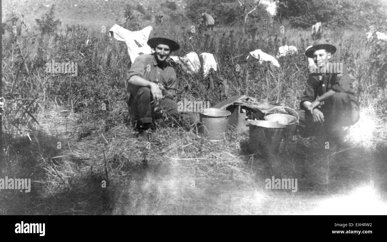 This historical photograph from Camp Funston shows two men washing ...