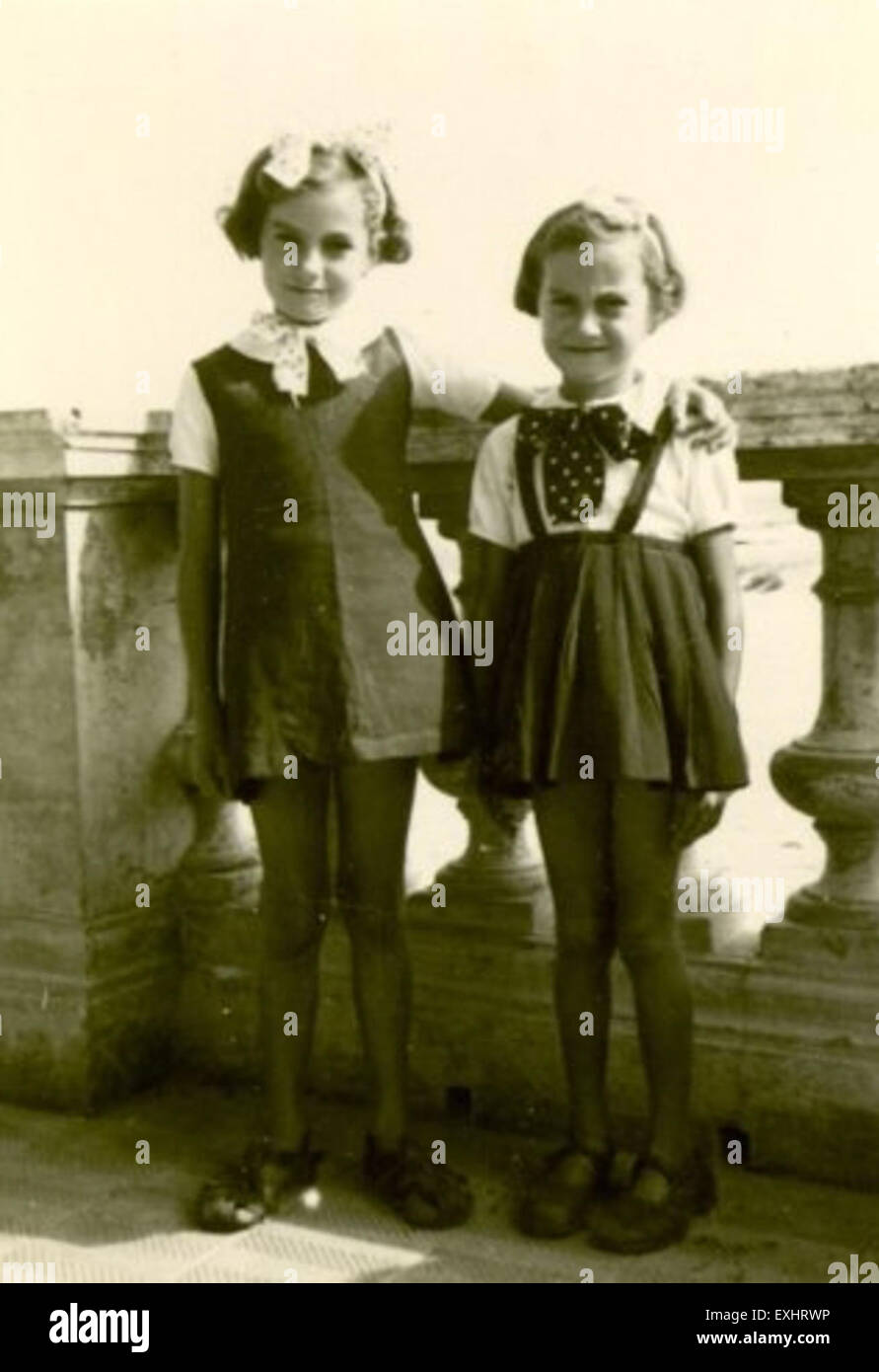The photograph, taken during World War II, depicts two young girls with ...
