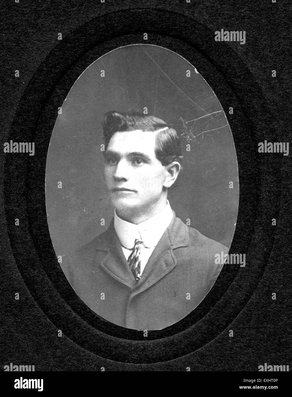 This formal portrait features an unidentified young man, presenting a ...