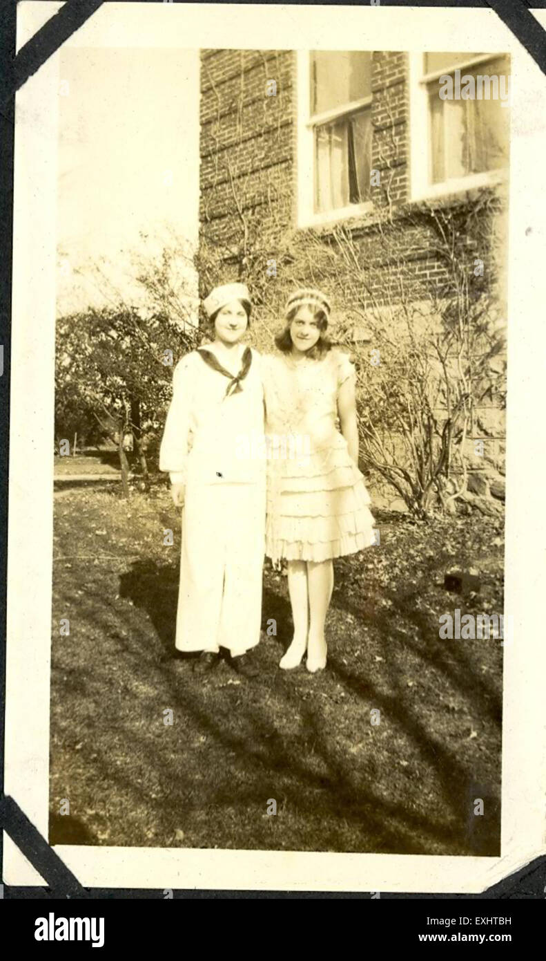 This photograph shows Verna Smith and a friend on the campus of Goshen ...
