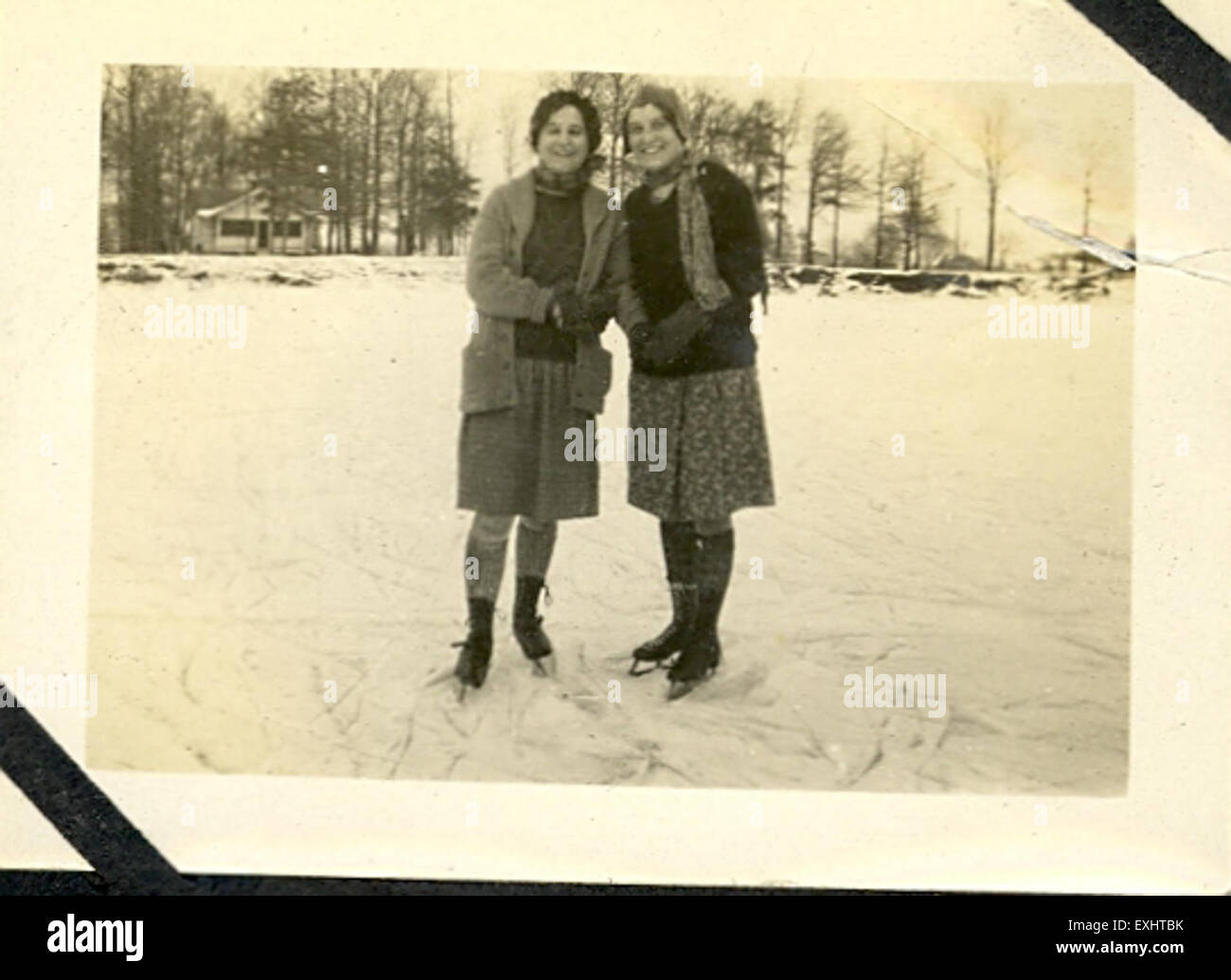 Verna Smith and a companion are seen skating on the frozen surface of ...