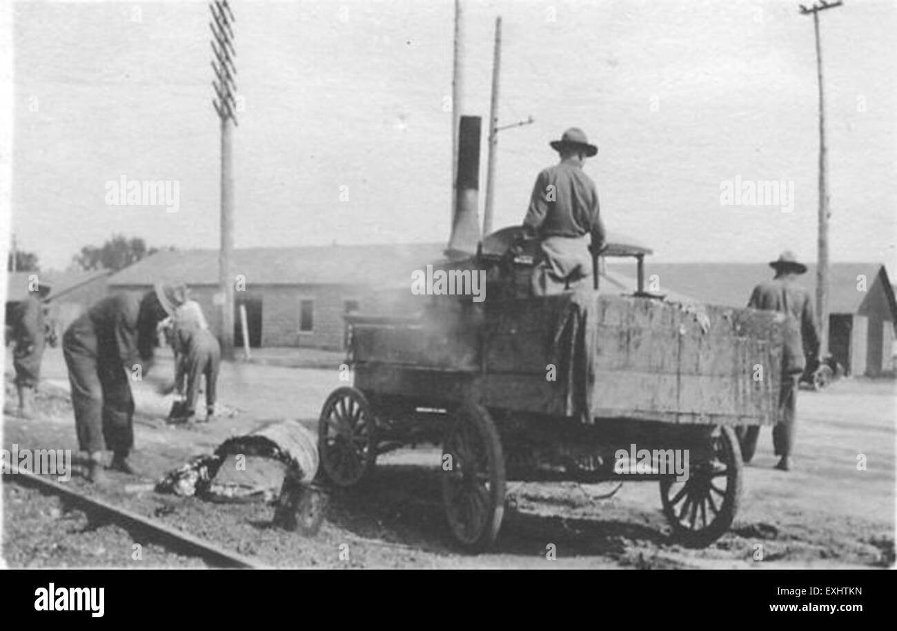 The photograph of Sgt. Swank at work on a tar wagon captures the ...