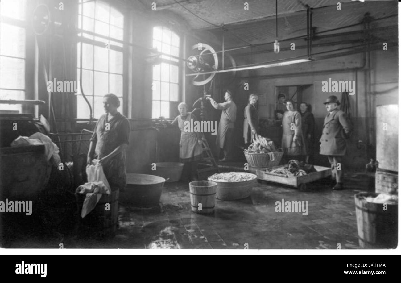 This photograph captures a traditional scene of people washing clothes ...