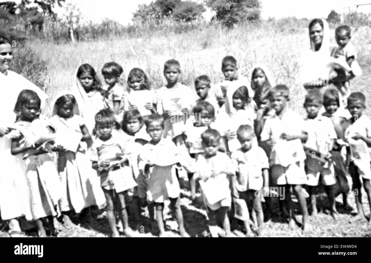 This historical image depicts the Bajhar Bible School in India, a ...