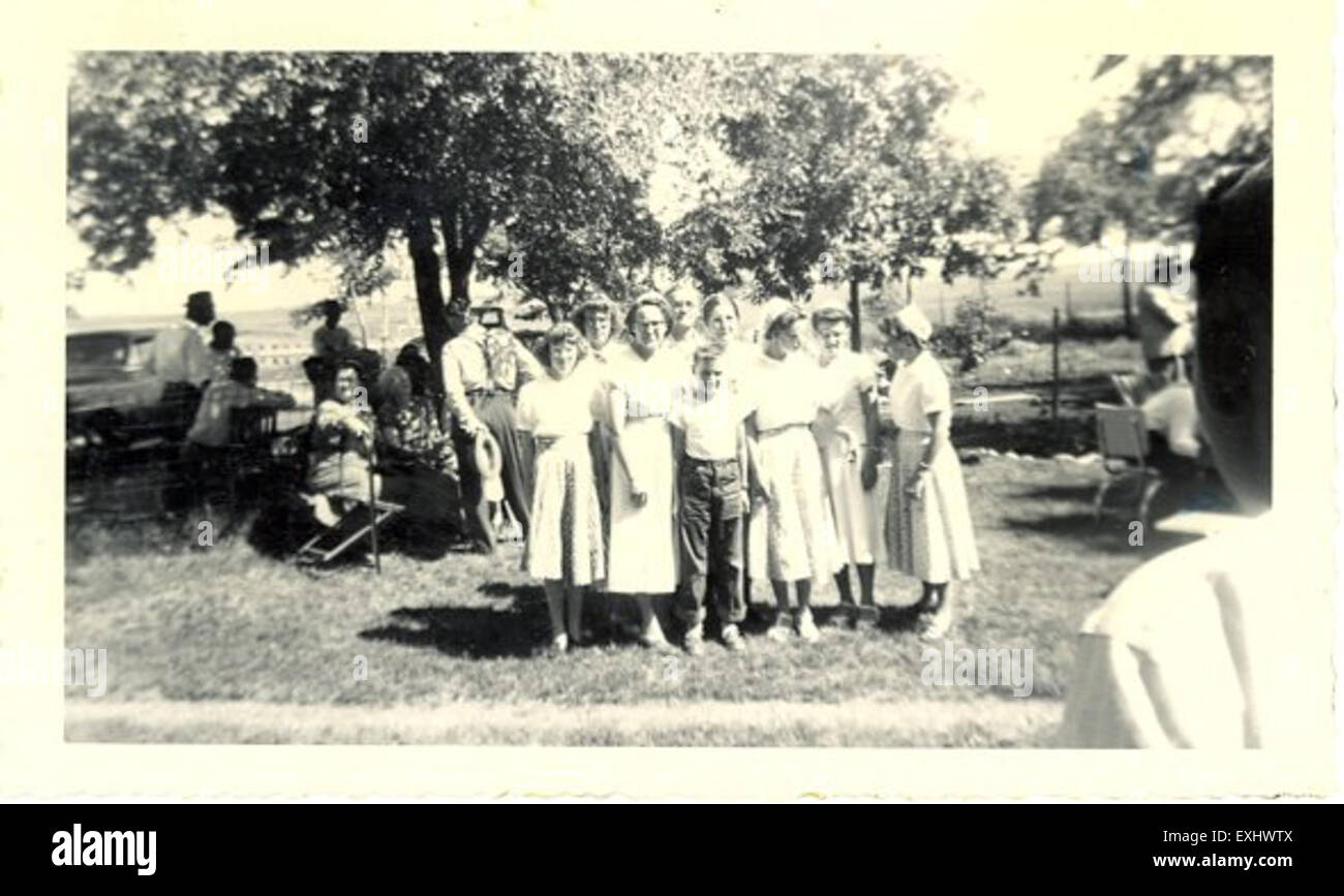 This photograph features *Bertha Greeser* with her family, including ...