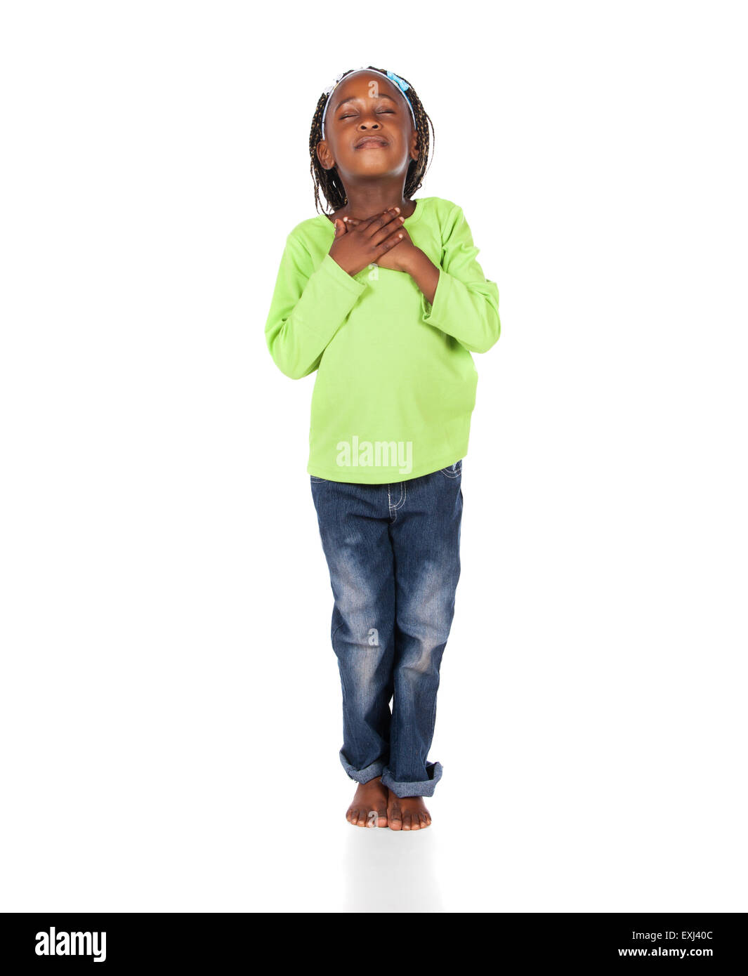 Adorable small african child with braids wearing a bright green shirt ...