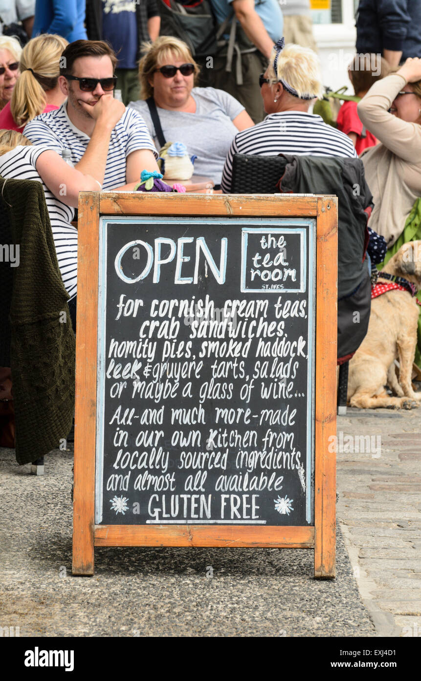 People sitting at tables outside The Tea Room, The Wharf, St Ives ...