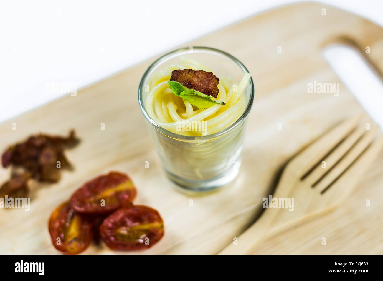 spaghetti pasta with Oregano bacon tomato Stock Photo - Alamy
