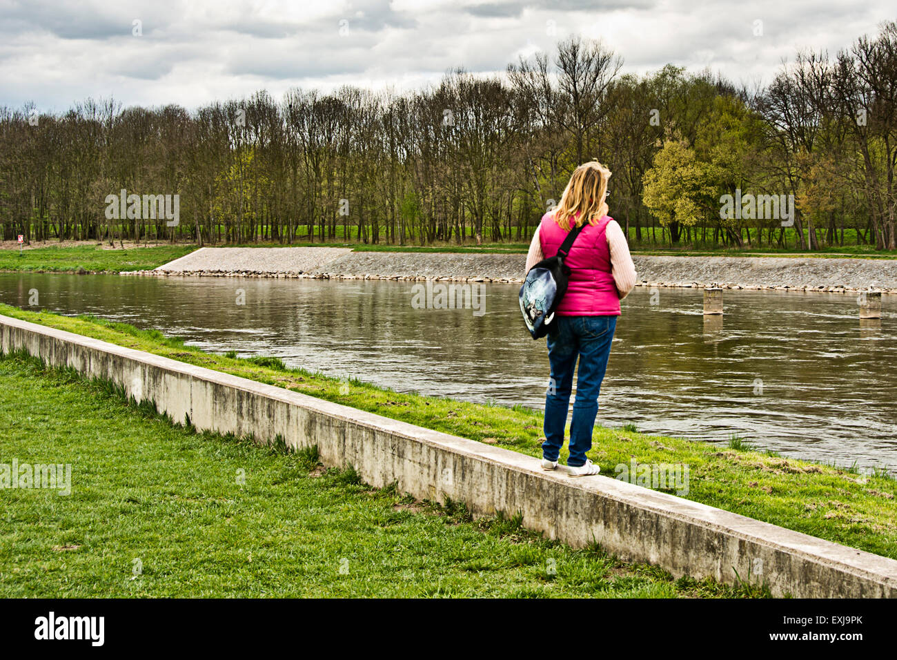 Woman standing by river hi-res stock photography and images - Alamy