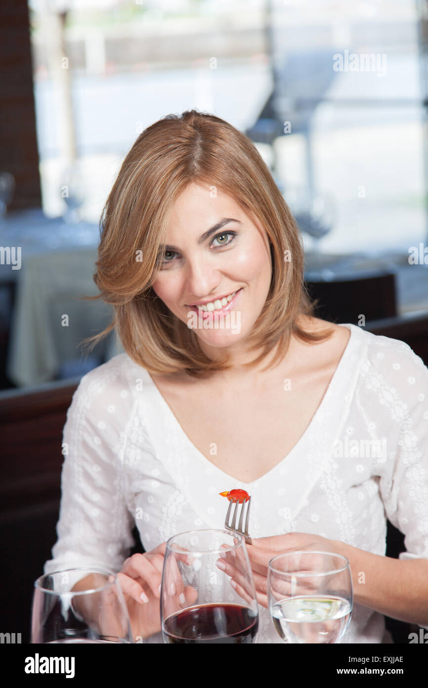 Woman eating some vegetables Stock Photo - Alamy