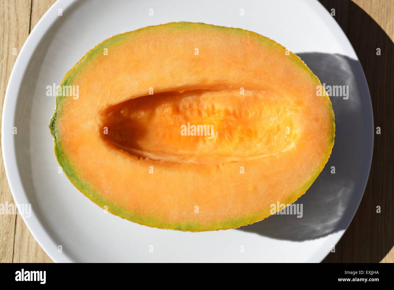 Melon on a plate Stock Photo - Alamy