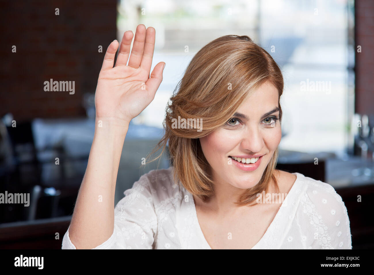 Woman calling waiter hi-res stock photography and images - Alamy