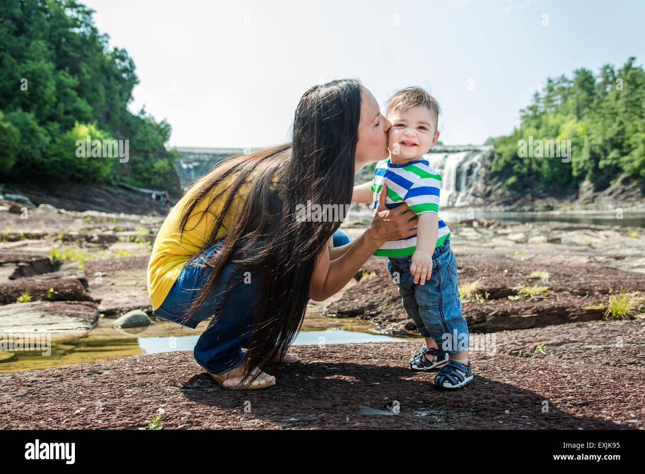 Mother and Son Having Fun. Mom kissing her son Stock Photo - Alamy