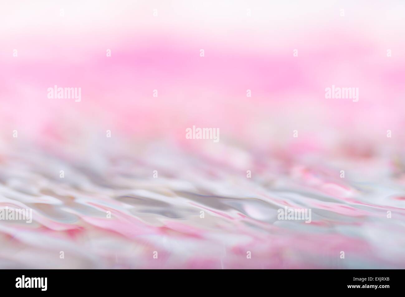 Moving water abstraction. Close up of water surface with colorful ...