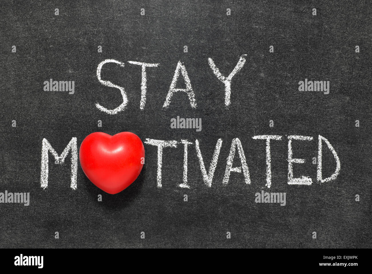 stay motivated phrase handwritten on blackboard with heart symbol ...