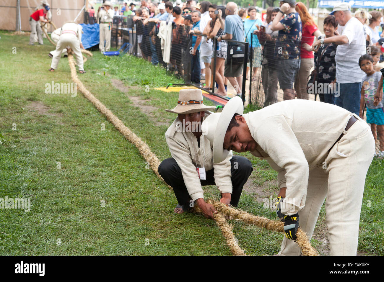 Native Peruvian men making rope Stock Photo - Alamy