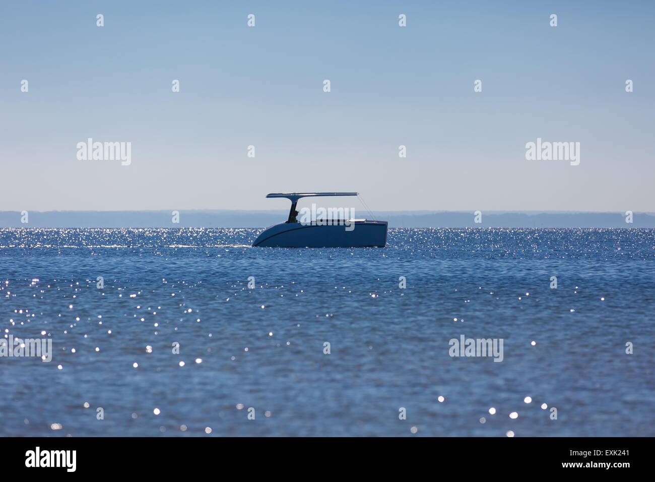 Small ship swimming on sea surface. Landscape of Gdanska bay with small ...