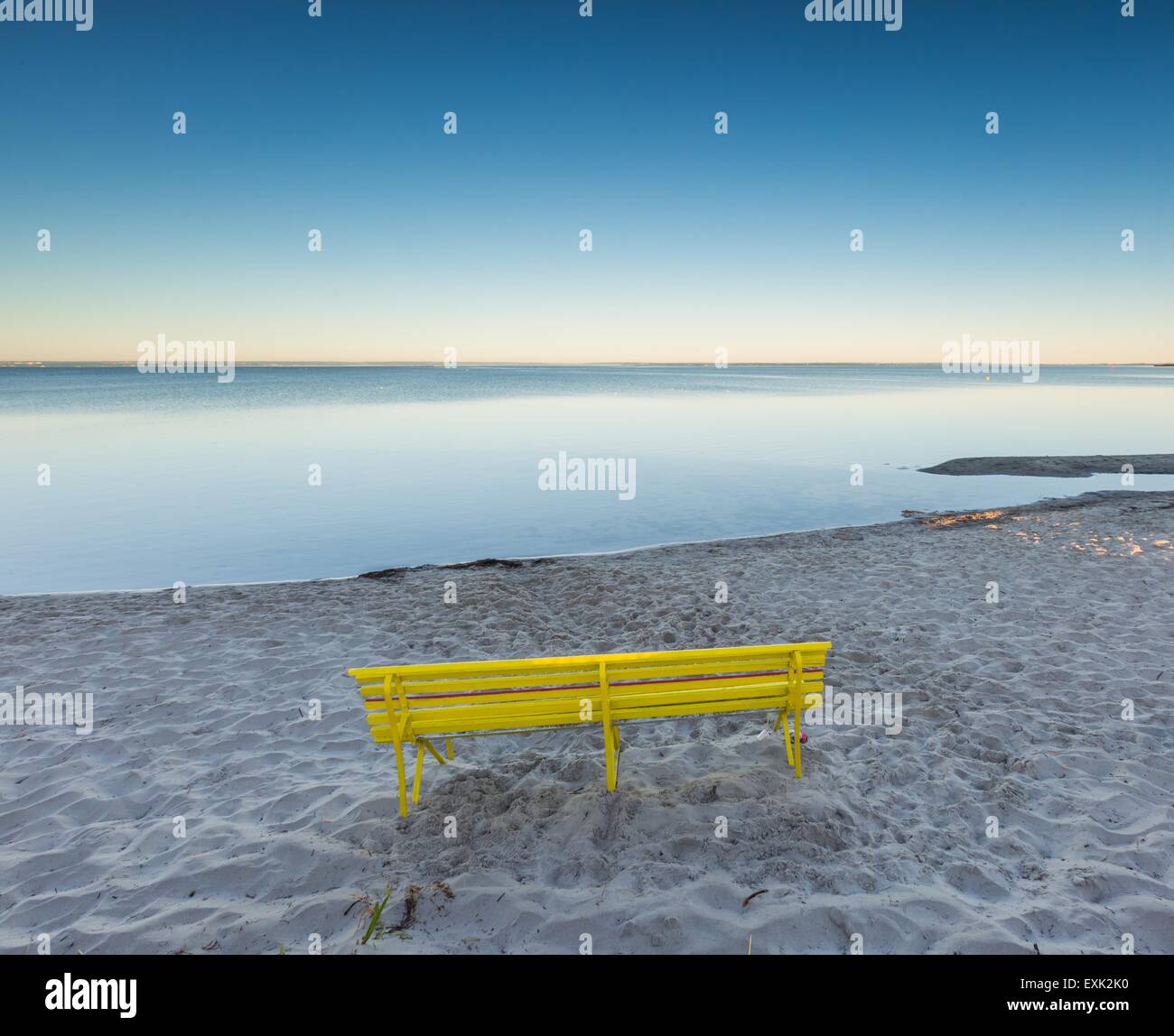Morning seascape with bench on sea shore. Beautiful landscape taken in ...