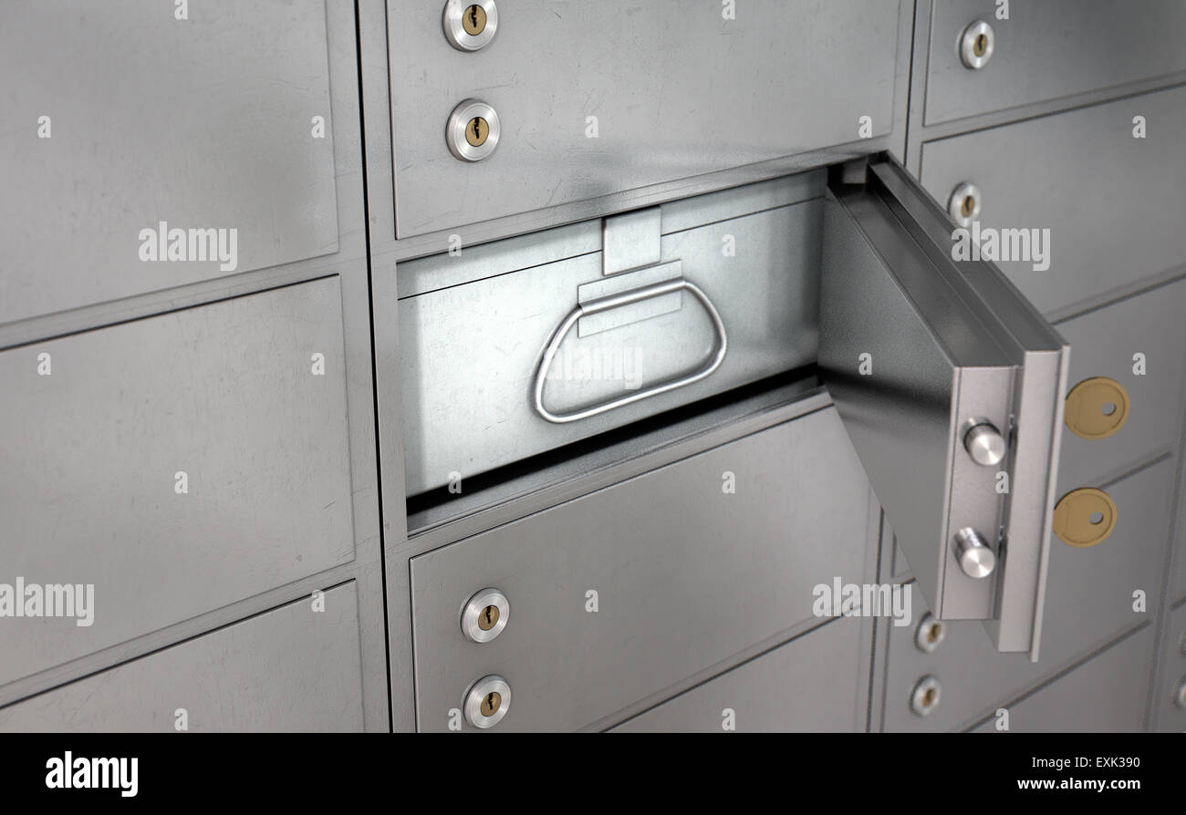 A closeup of a wall of closed metal safety deposit boxes with one open ...