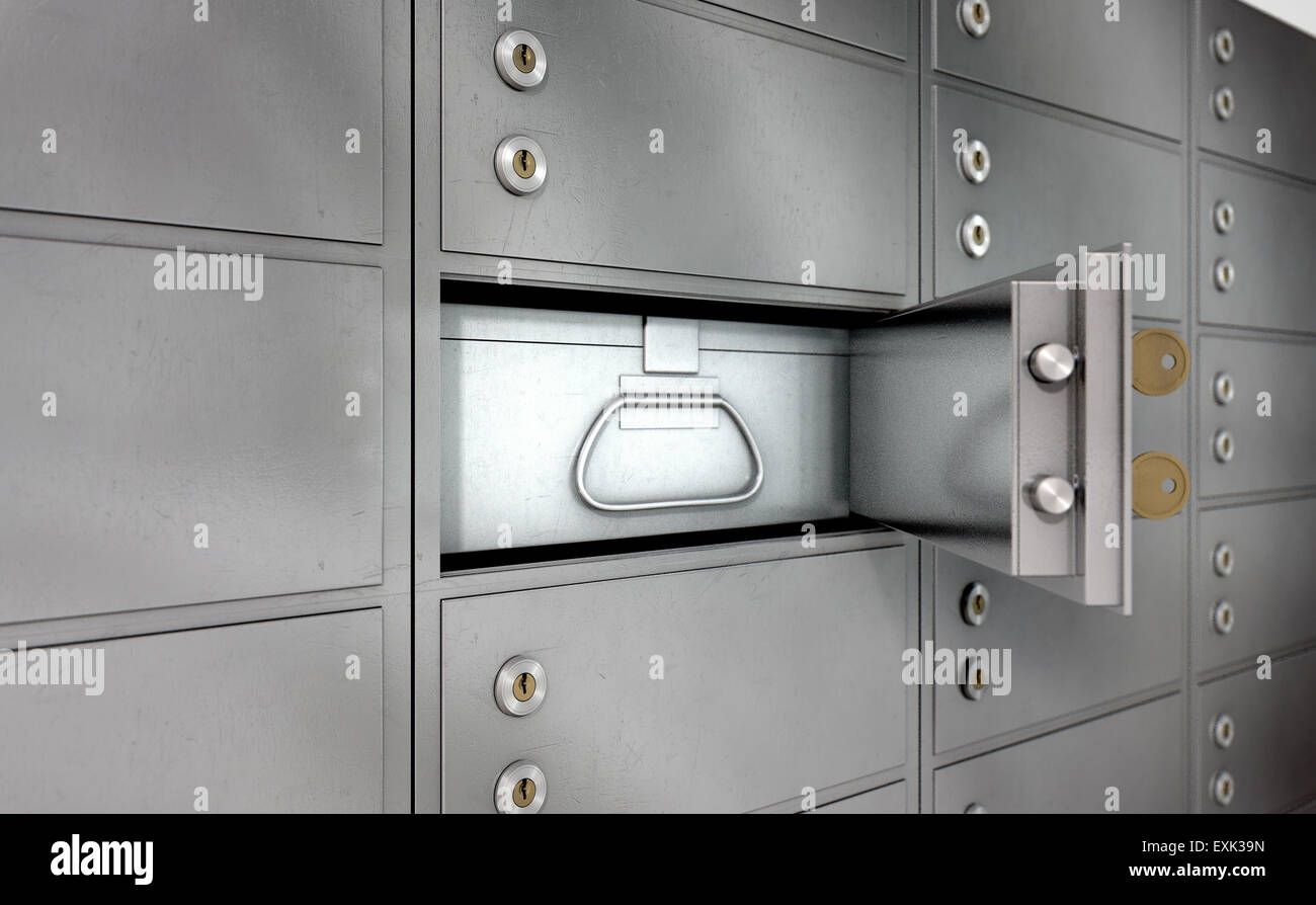 A closeup of a wall of closed metal safety deposit boxes with one open ...
