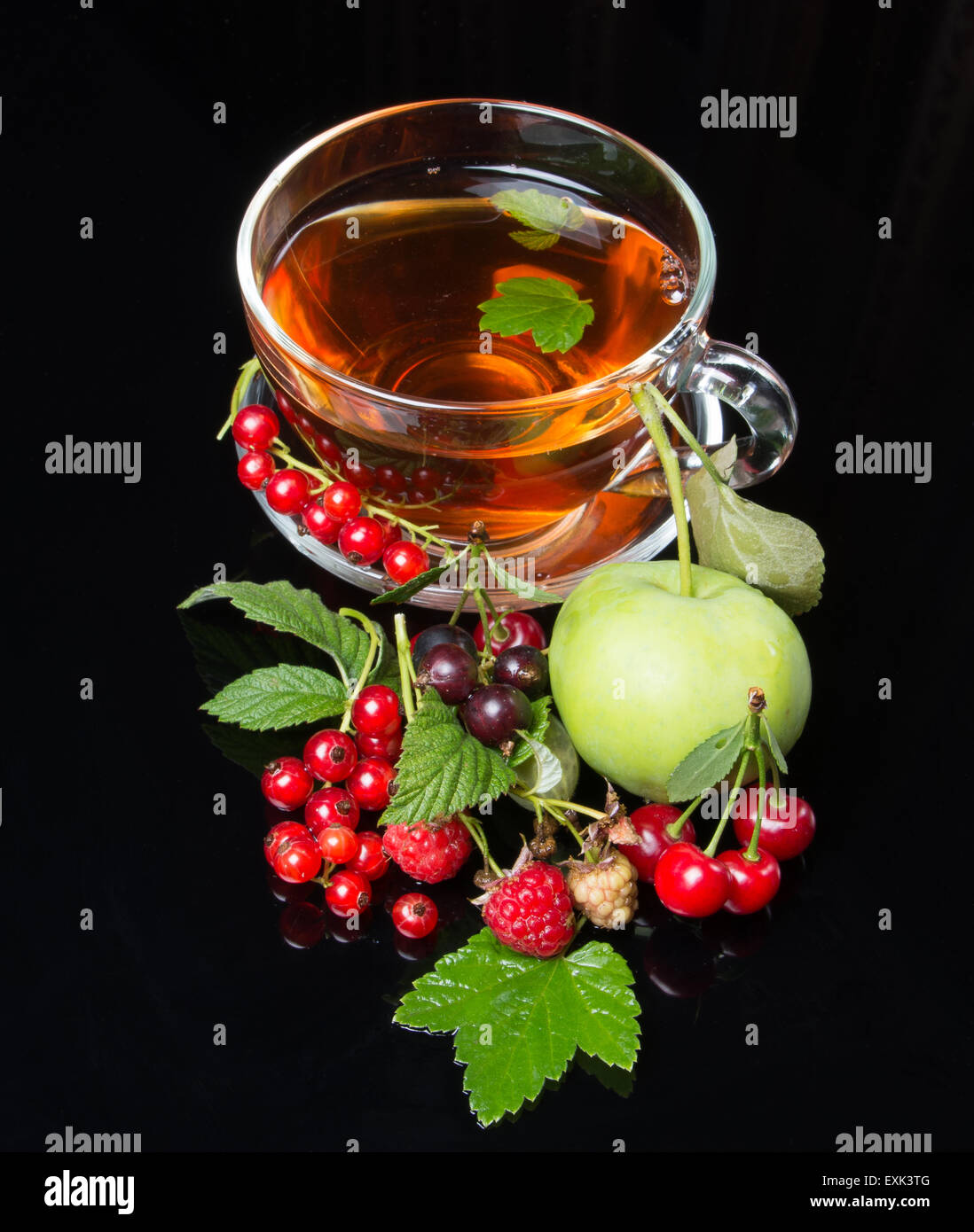 berry cuts black tea on black background Stock Photo - Alamy