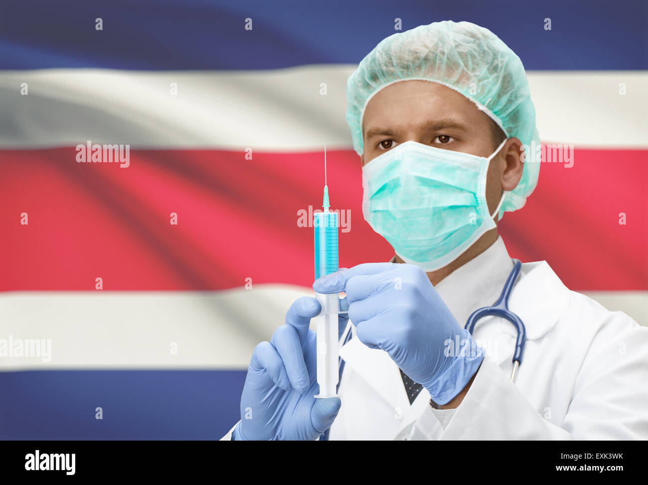 Doctor with syringe in hands and flag on background - Costa Rica Stock ...