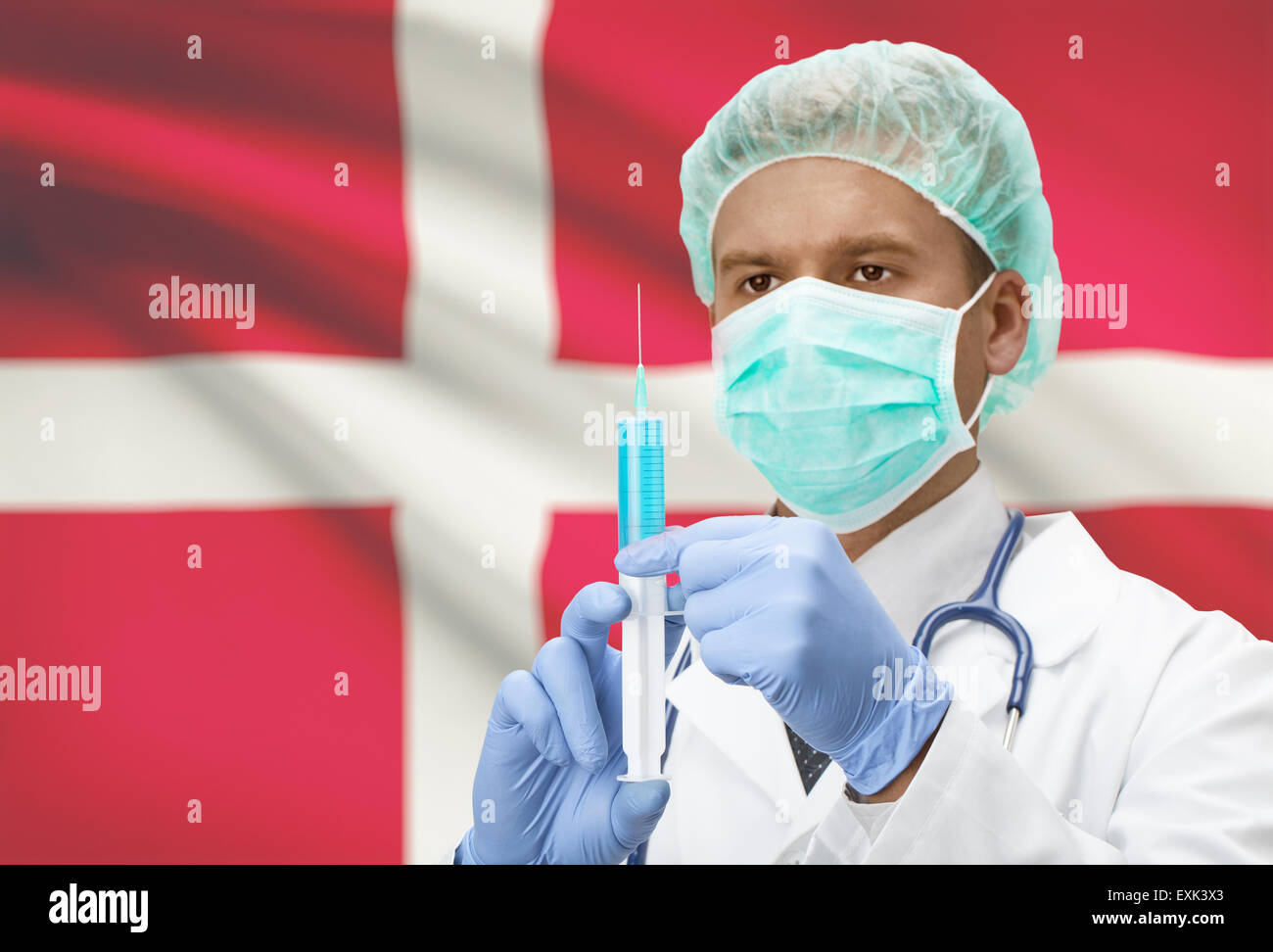 Doctor with syringe in hands and flag on background - Denmark Stock ...